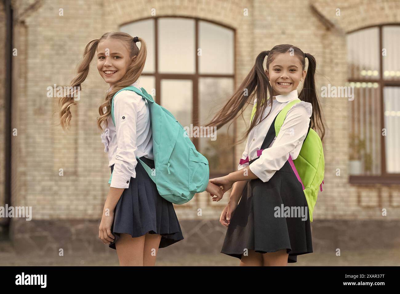 happy two school girls best friends together outdoor Stock Photo - Alamy