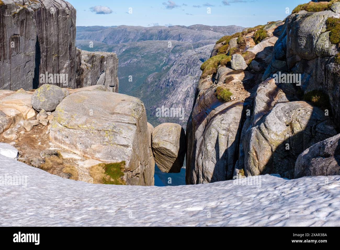 A close-up view of the famous balancing rock at Kjeragbolten, Norway ...