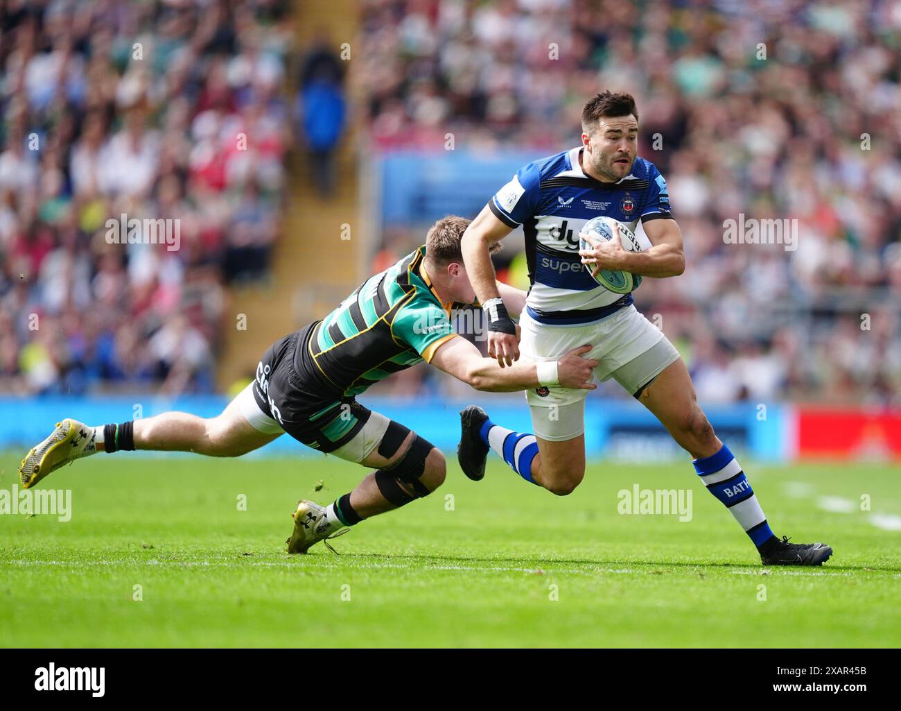 Bath Rugby's Will Muir is tackled by Northampton Saints' Tommy Freeman ...