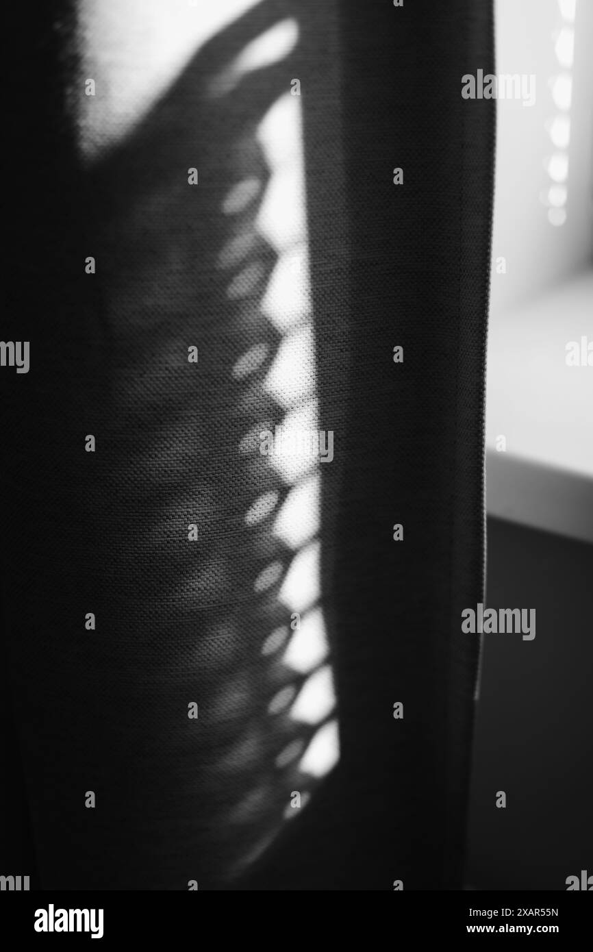 shadow of the rays falling on the wall through curtains. Abstract ...
