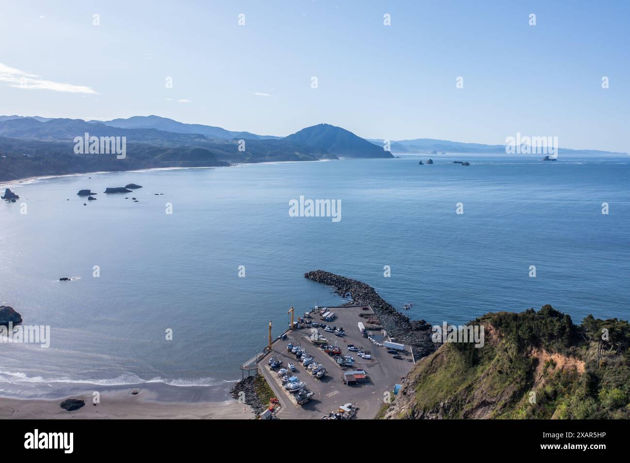 Port Orford, Oregon, aerial view of harbor and Humbug Mountain Stock ...