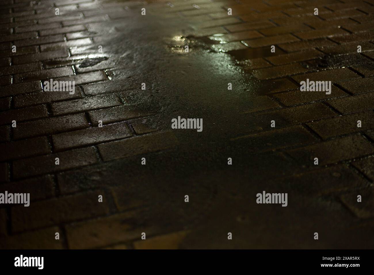 Wet floor. Tiles on the floor. Puddle in the garage. Interior details ...