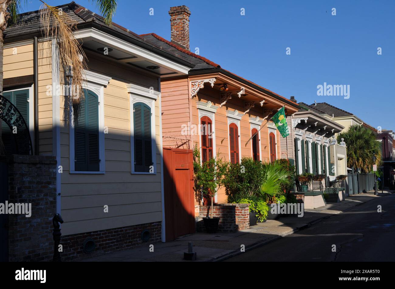 Colorfully painted cottage row houses with highly decorative facades ...