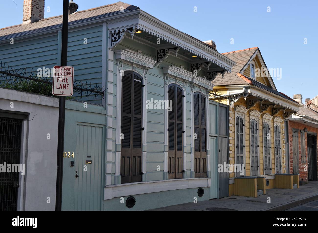 Colorfully painted cottage row houses with highly decorative facades ...