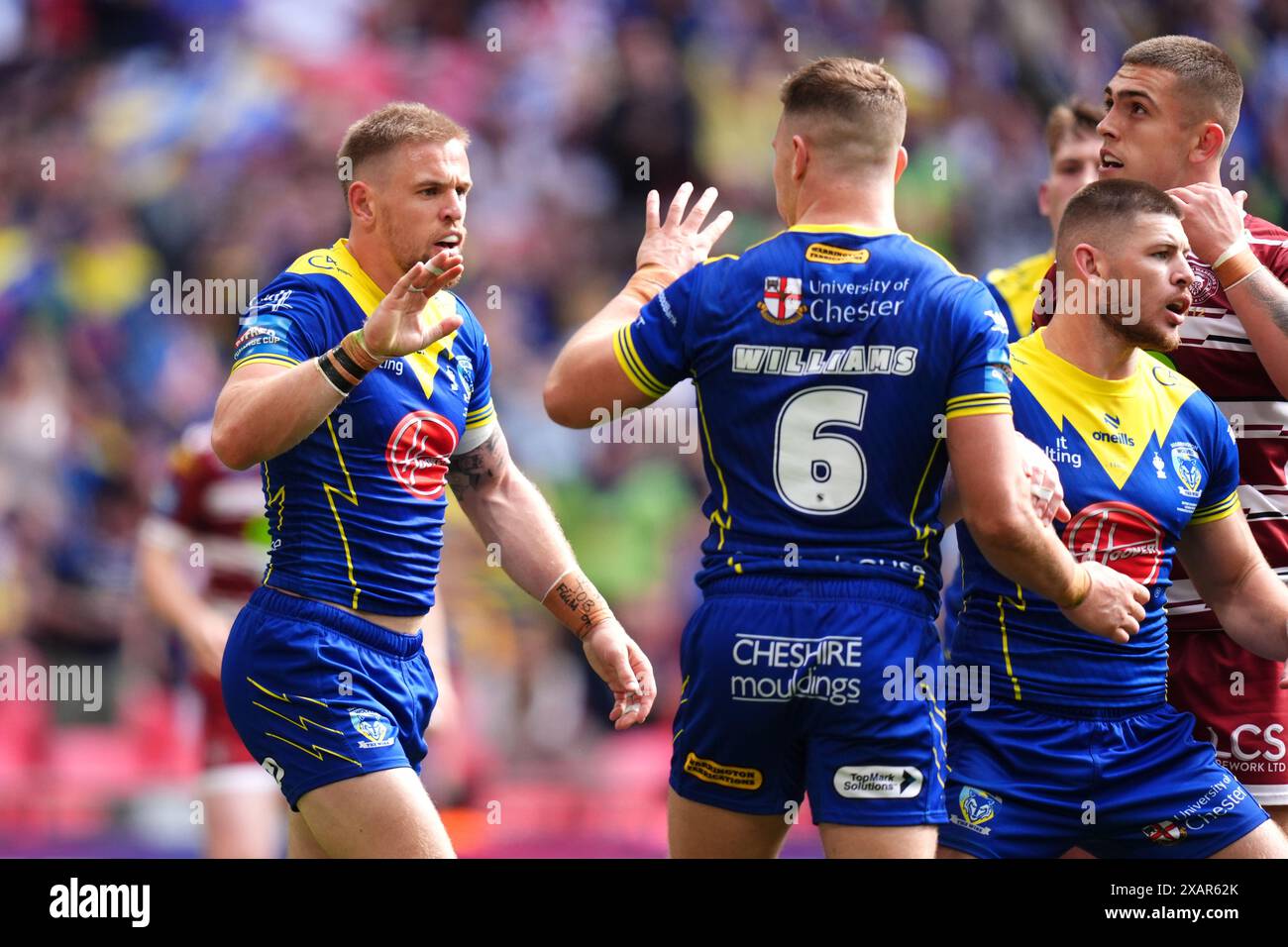 Warrington Wolves' Matt Dufty (left) celebrates scoring his side's ...