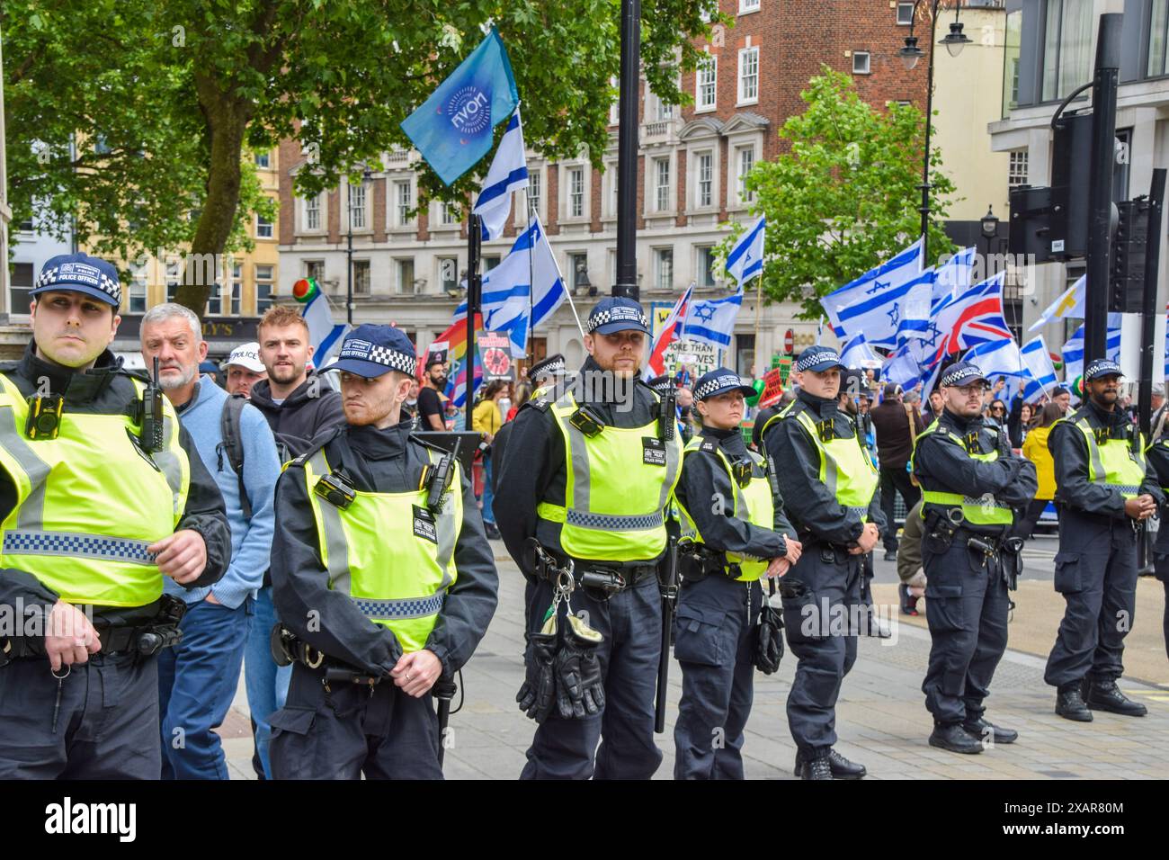London, England, UK. 8th June, 2024. Police officers form a cordon in ...