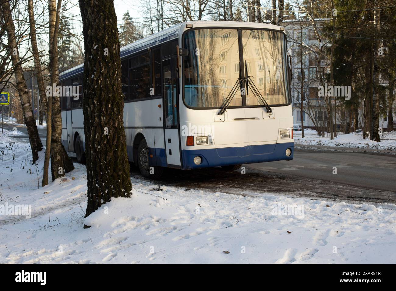 Public transport in winter. Bus parking. Old car. Large windshield ...
