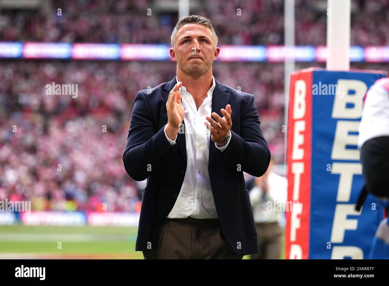 Warrington Wolves head coach Sam Burgess applauds the fans after the Betfred Challenge Cup final ...