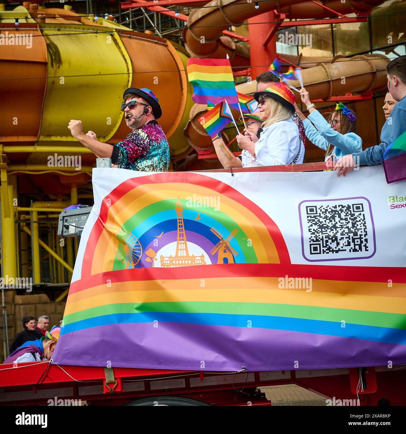 Pride parade along Blackpool Promenade 2024. Miniature pink mini car ...