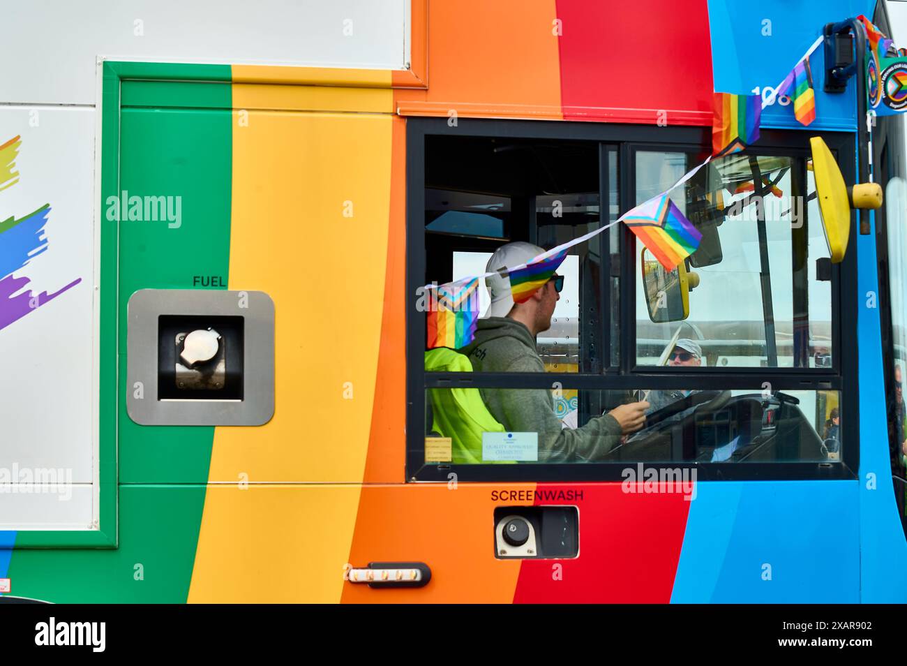 Pride parade along Blackpool Promenade 2024.Rainbow coloured bus Stock ...