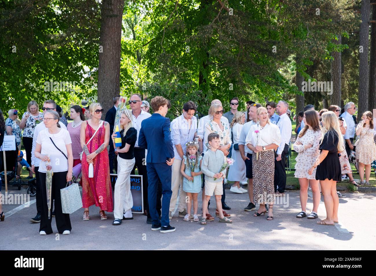 Families gather outside the main school building for Åland Graduation ...