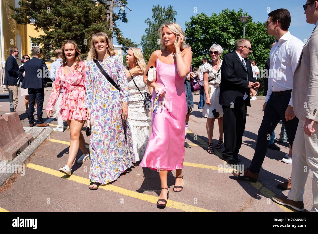 FRIENDS IN SUMMER DRESSES WAIT TO CELEBRATE GRADUATION, MARIEHAMN ...