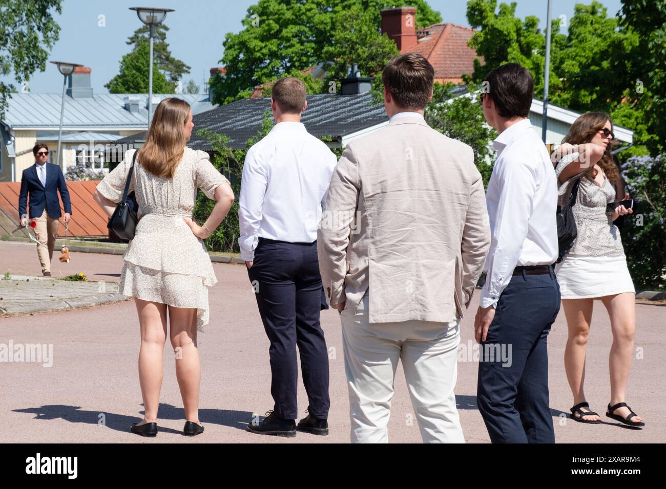 Families wait outside the main school building for Åland Graduation Day ...