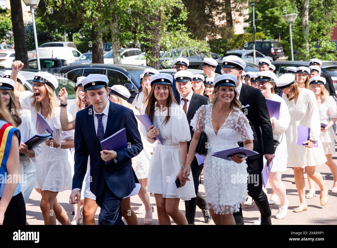 The new school graduates march through the streets of Mariehamn from ...