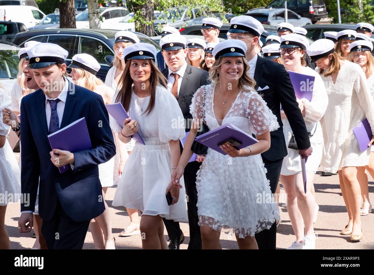 The new school graduates march through the streets of Mariehamn from ...