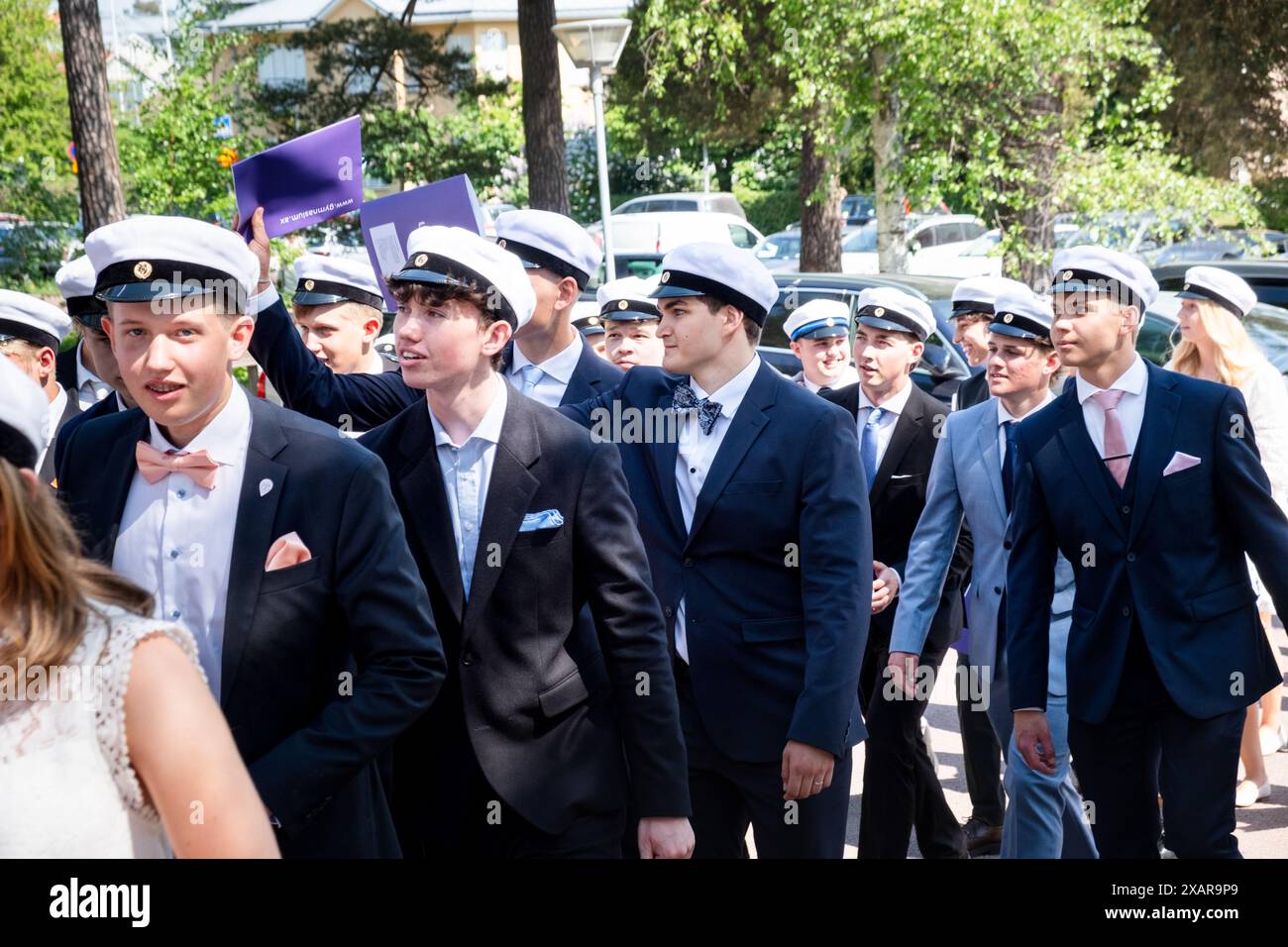 The new school graduates march through the streets of Mariehamn from ...