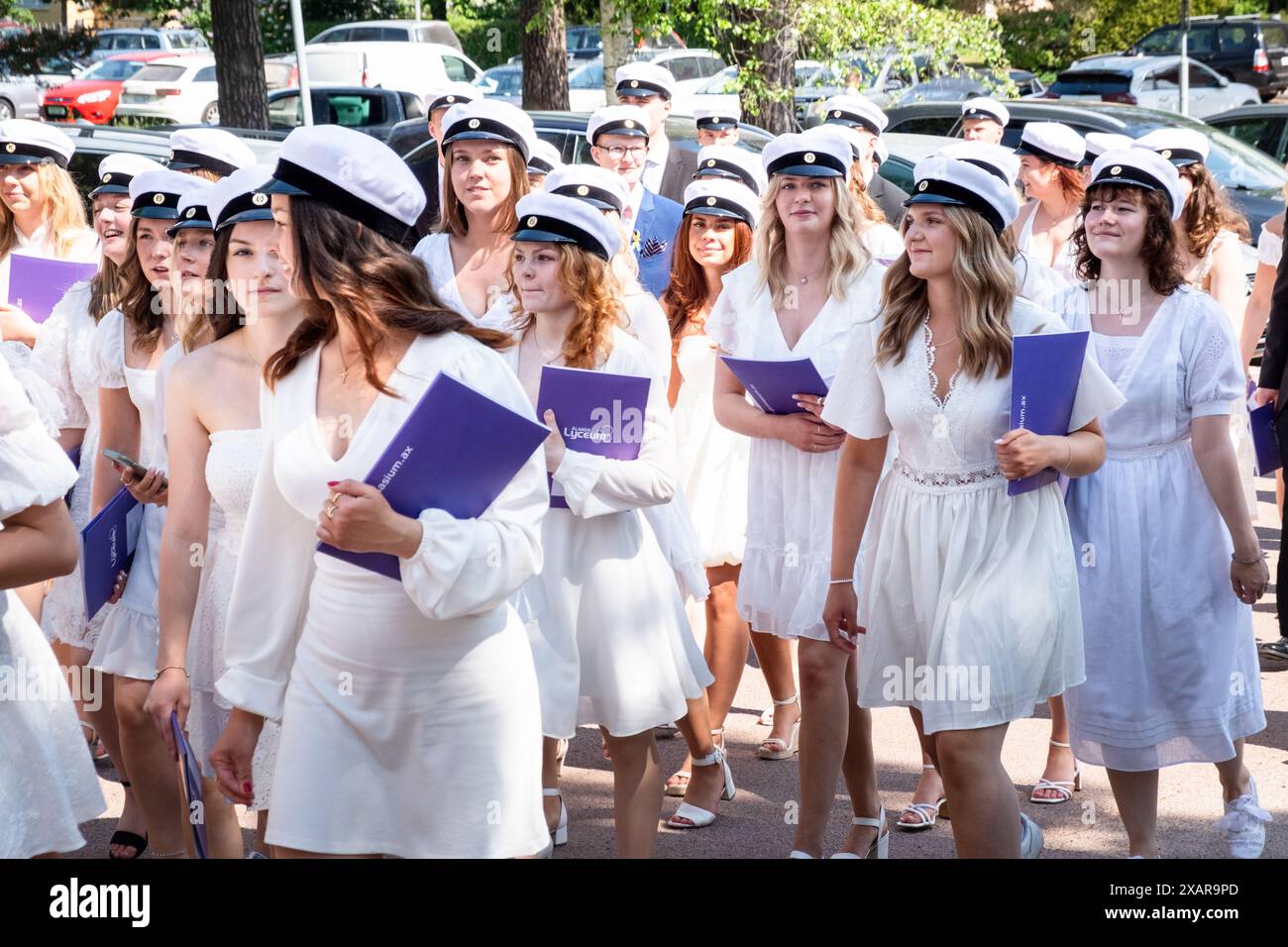 The new school graduates march through the streets of Mariehamn from ...