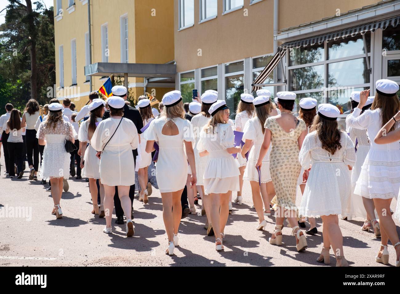 The new school graduates march through the streets of Mariehamn from ...