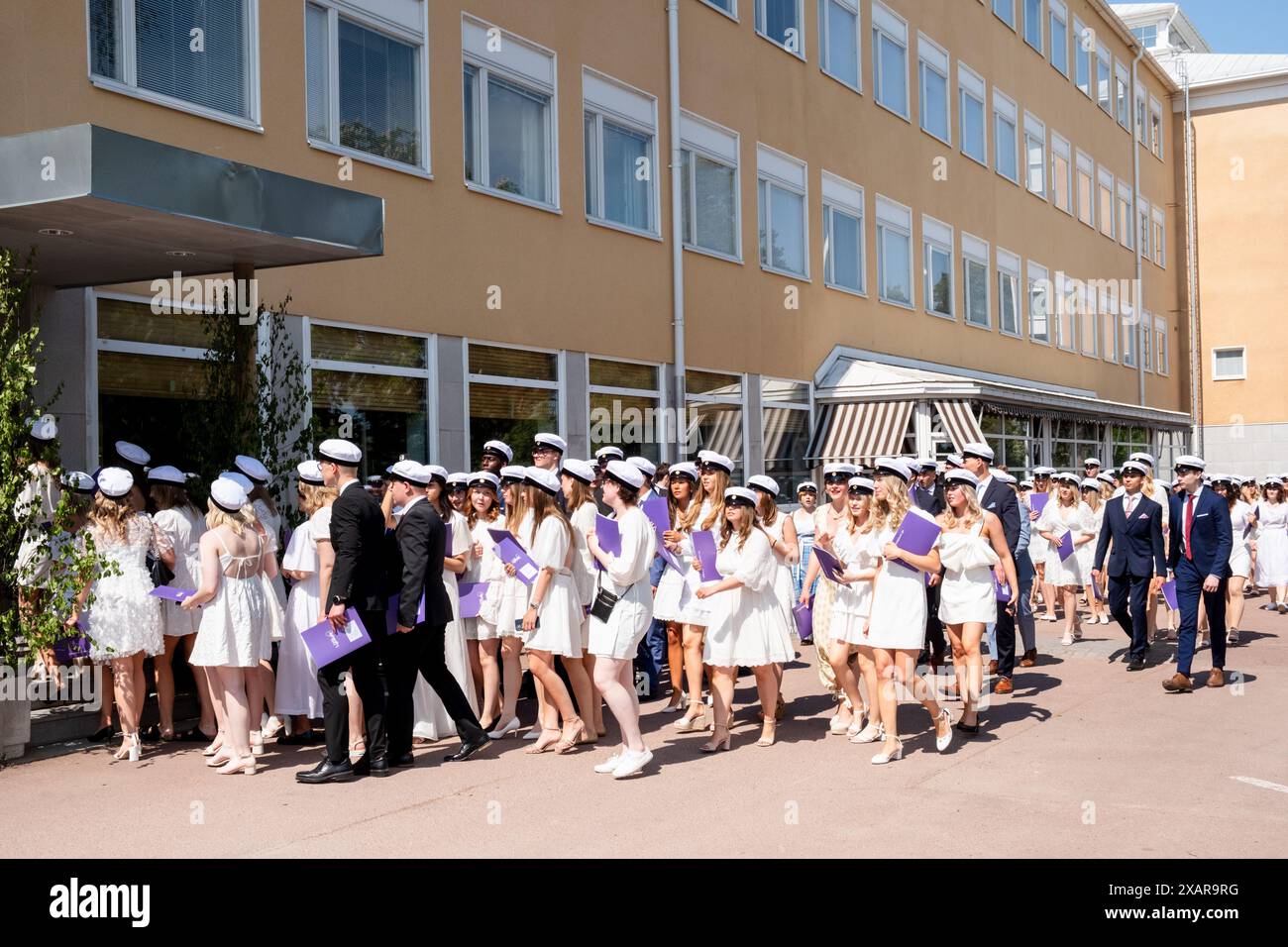 The new school graduates march through the streets of Mariehamn from ...