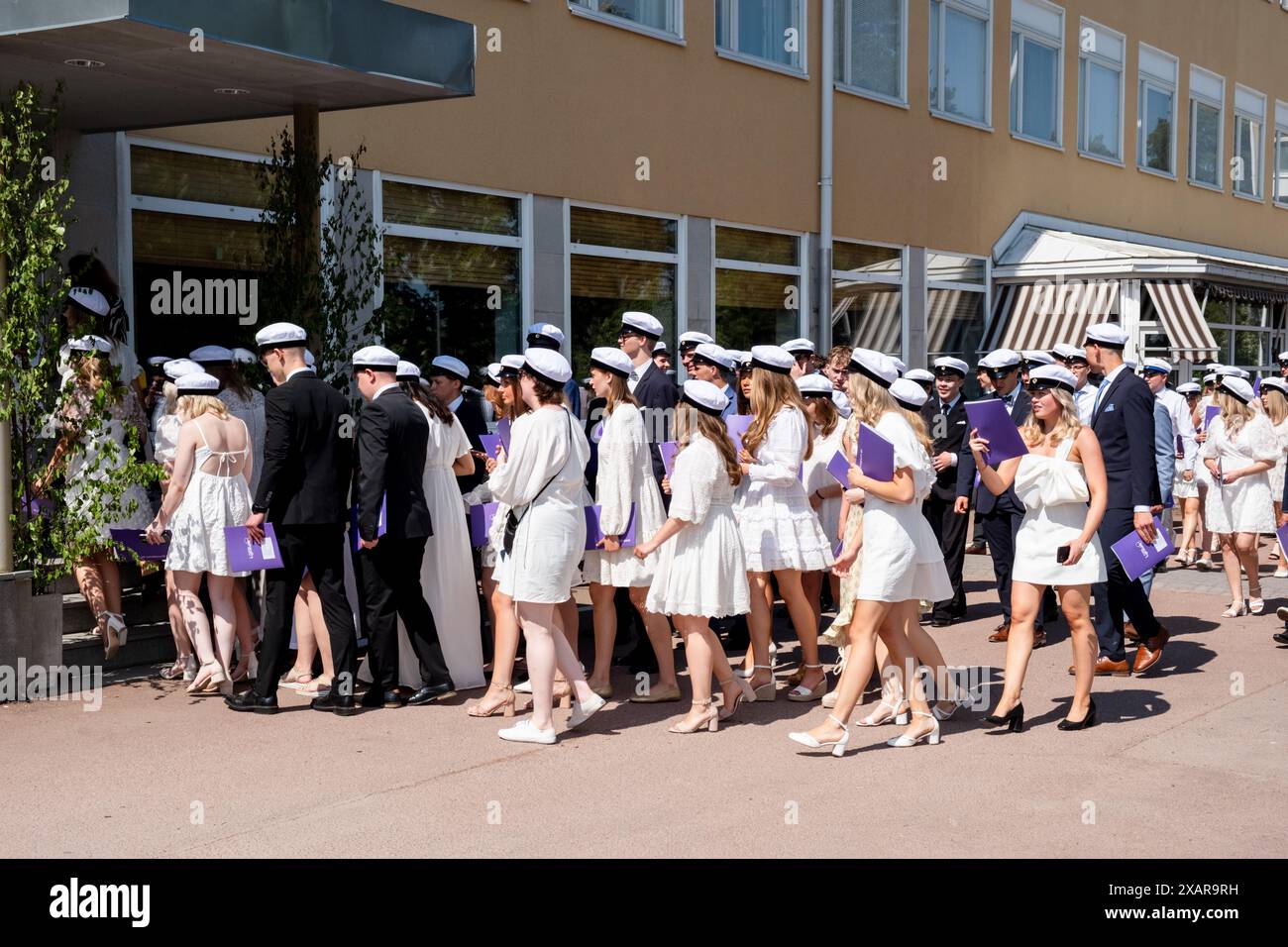 The new school graduates march through the streets of Mariehamn from ...