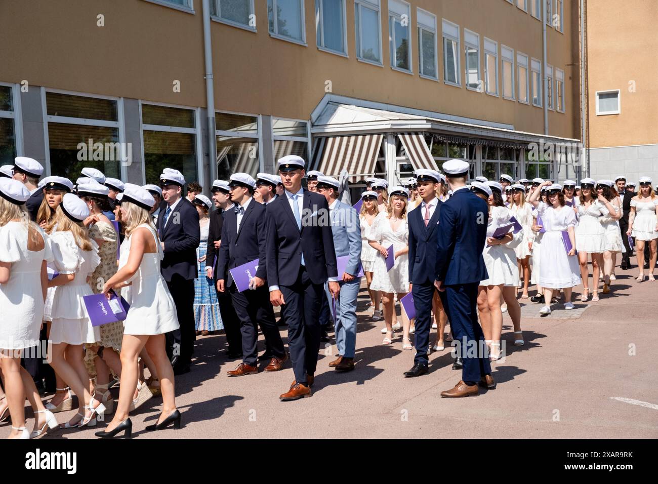 The new school graduates march through the streets of Mariehamn from ...