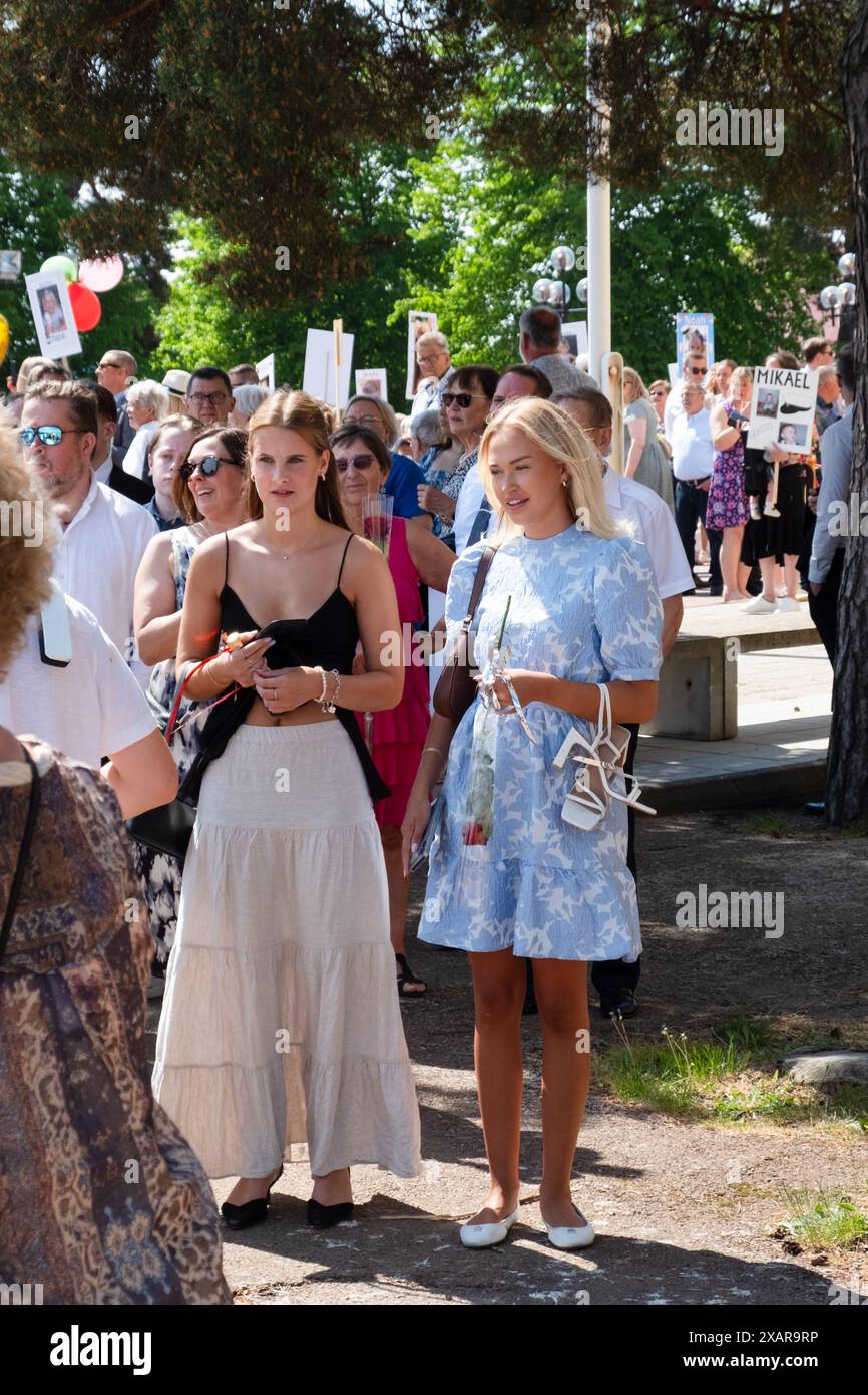 Families and friends gather outside the main school building for Åland ...