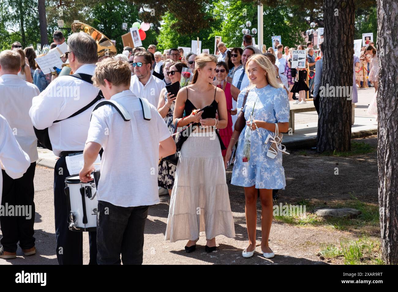 Families and friends gather outside the main school building for Åland ...