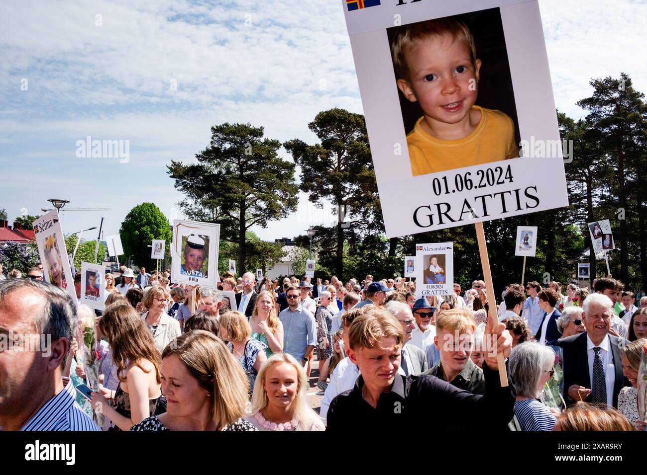 It's a sea of placards and mobile phones as friends and families gather ...