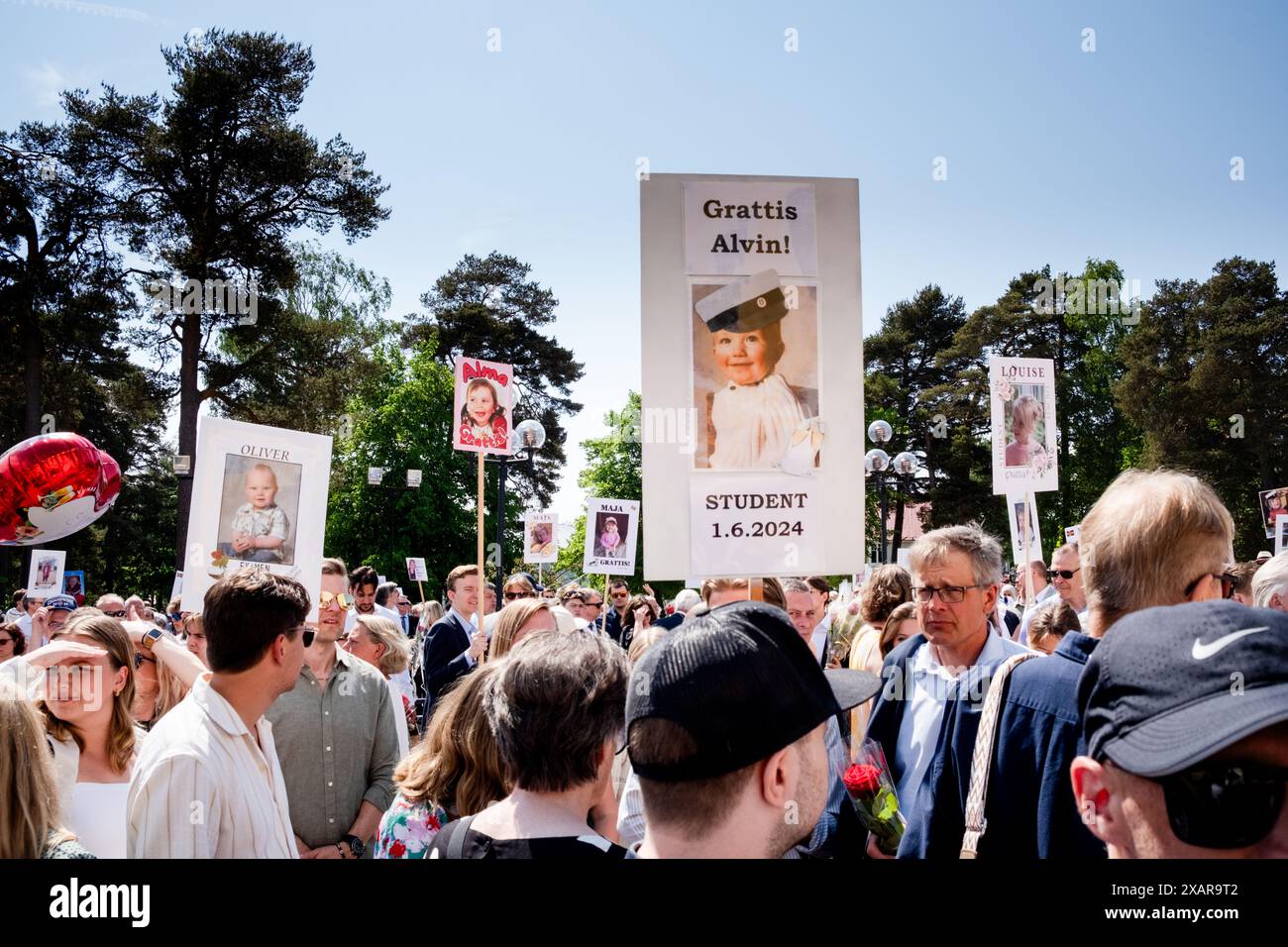 It's a sea of placards and mobile phones as friends and families gather ...