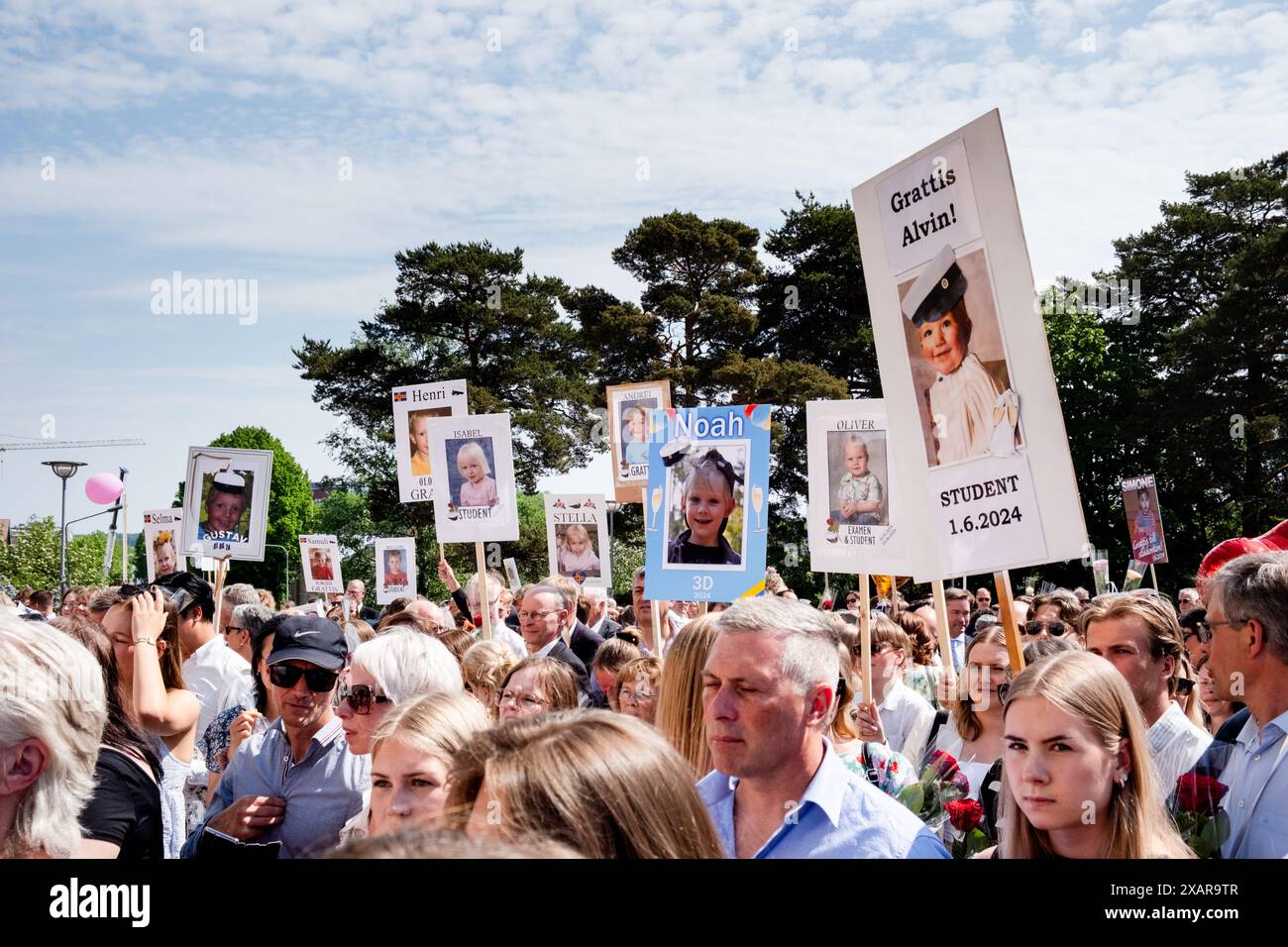 It's a sea of placards and mobile phones as friends and families gather ...