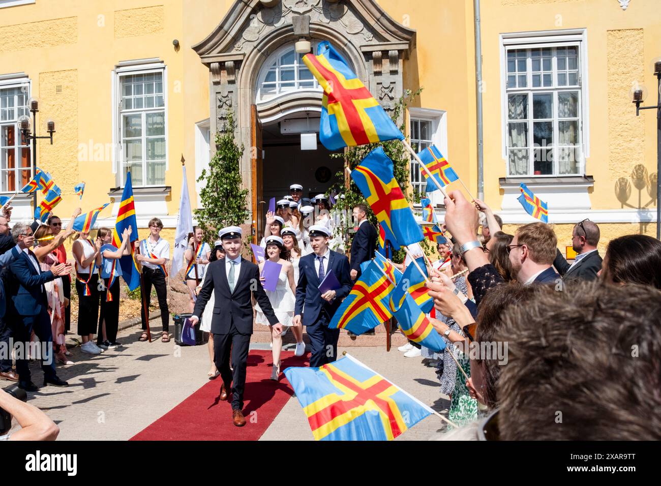 The new graduates emerge from their school for the final time to a ...