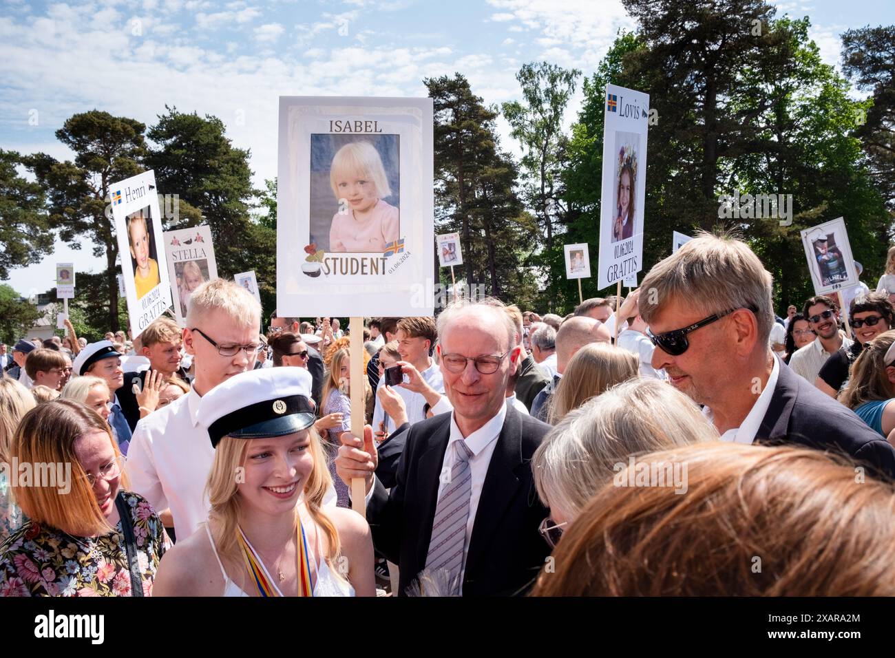 It's a sea of placards and mobile phones as friends and families ...