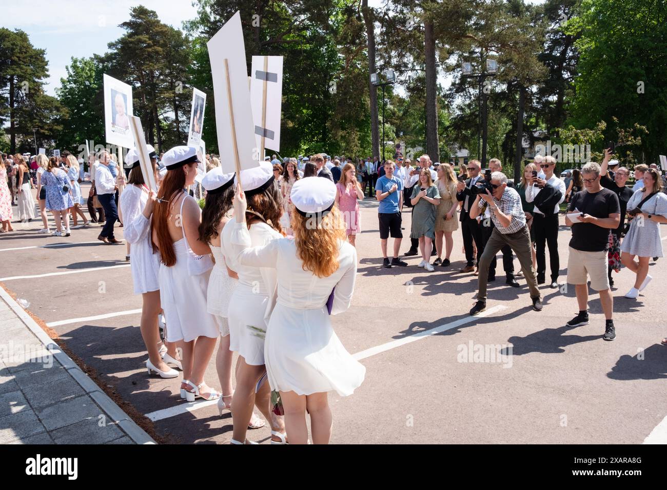 GIRLS POSE FOR GROUP PICTURE, ÅLAND GRADUATION, MARIEHAMN: A large ...
