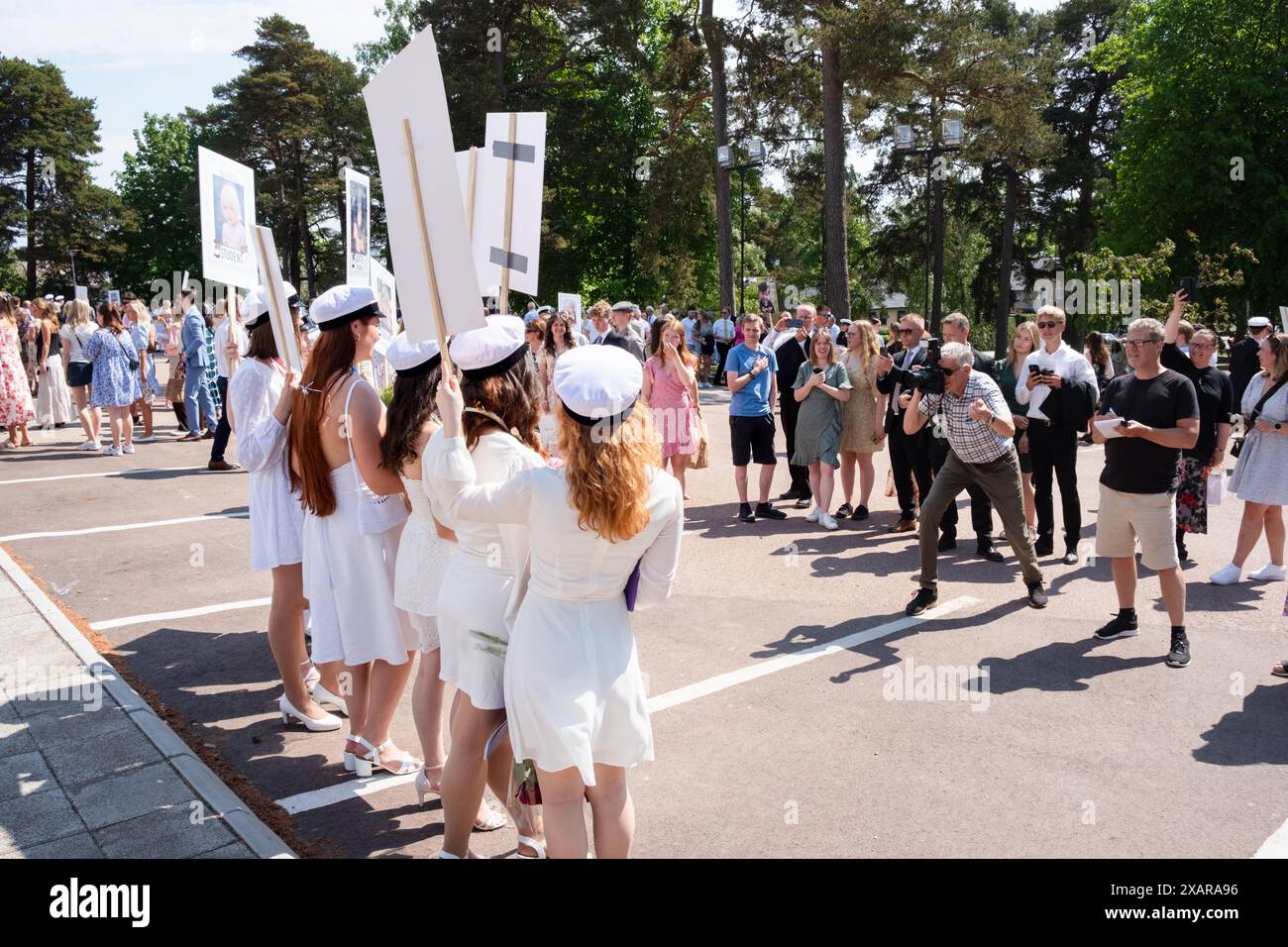 GIRLS POSE FOR GROUP PICTURE, ÅLAND GRADUATION, MARIEHAMN: A large ...
