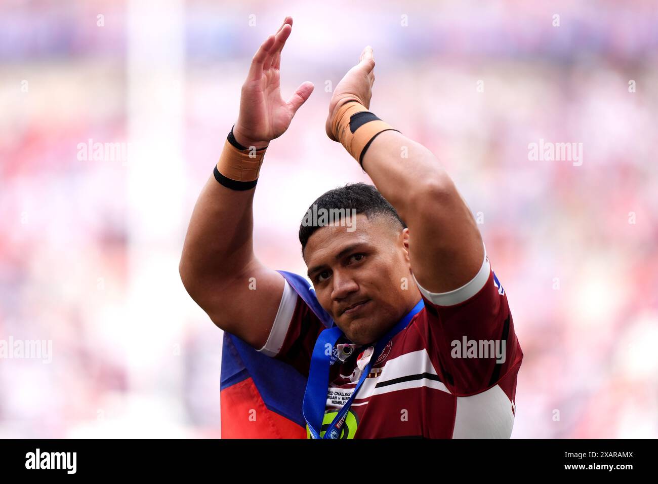 Wigan Warriors' Patrick Mago applauds the fans after the final whistle ...
