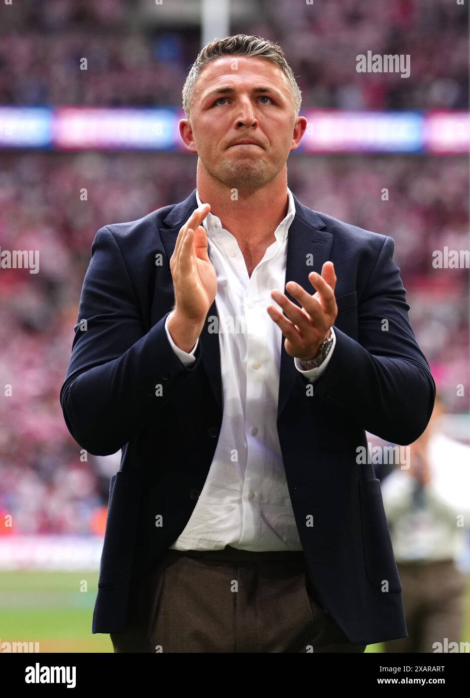 Warrington Wolves head coach Sam Burgess applauds the fans after the Betfred Challenge Cup final ...