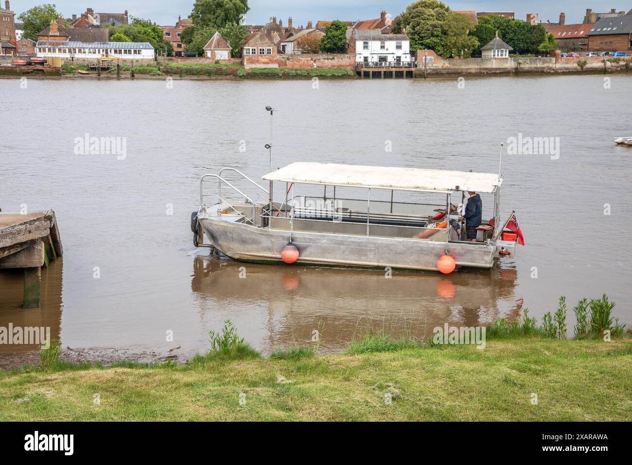 Ferry leaving dock Stock Photo - Alamy
