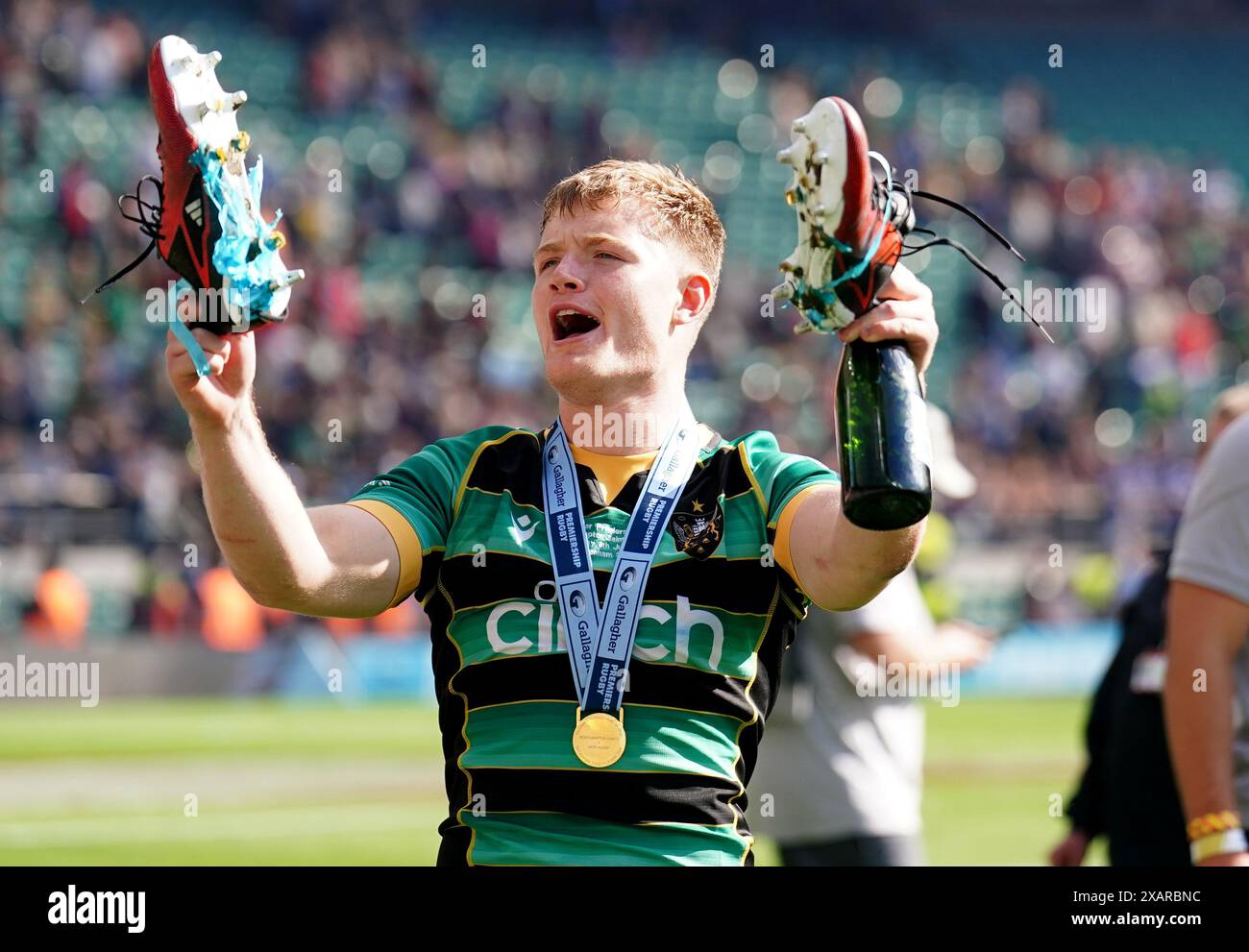Northampton Saints' Fin Smith celebrates on the pitch after the ...