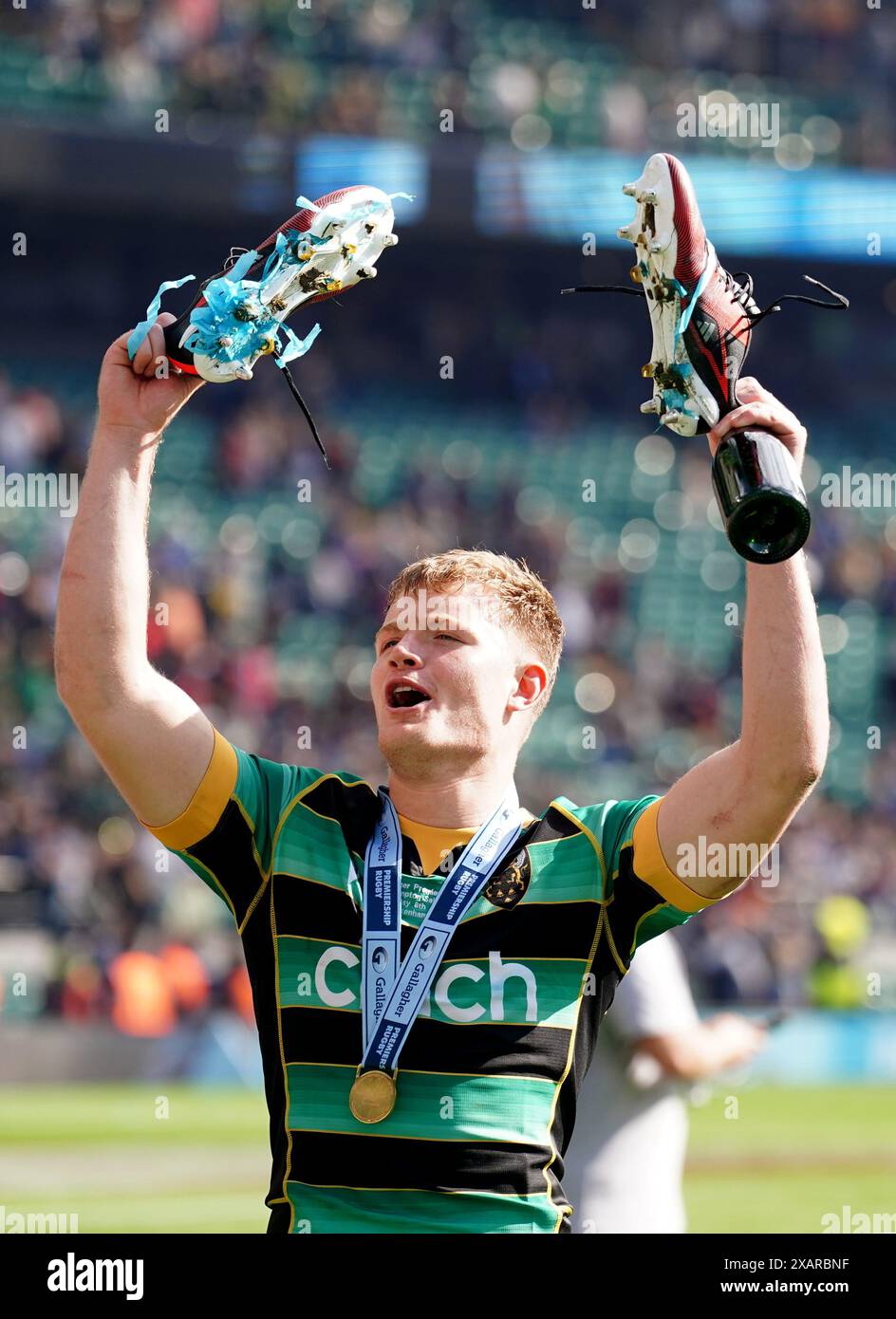 Northampton Saints' Fin Smith celebrates on the pitch after the ...