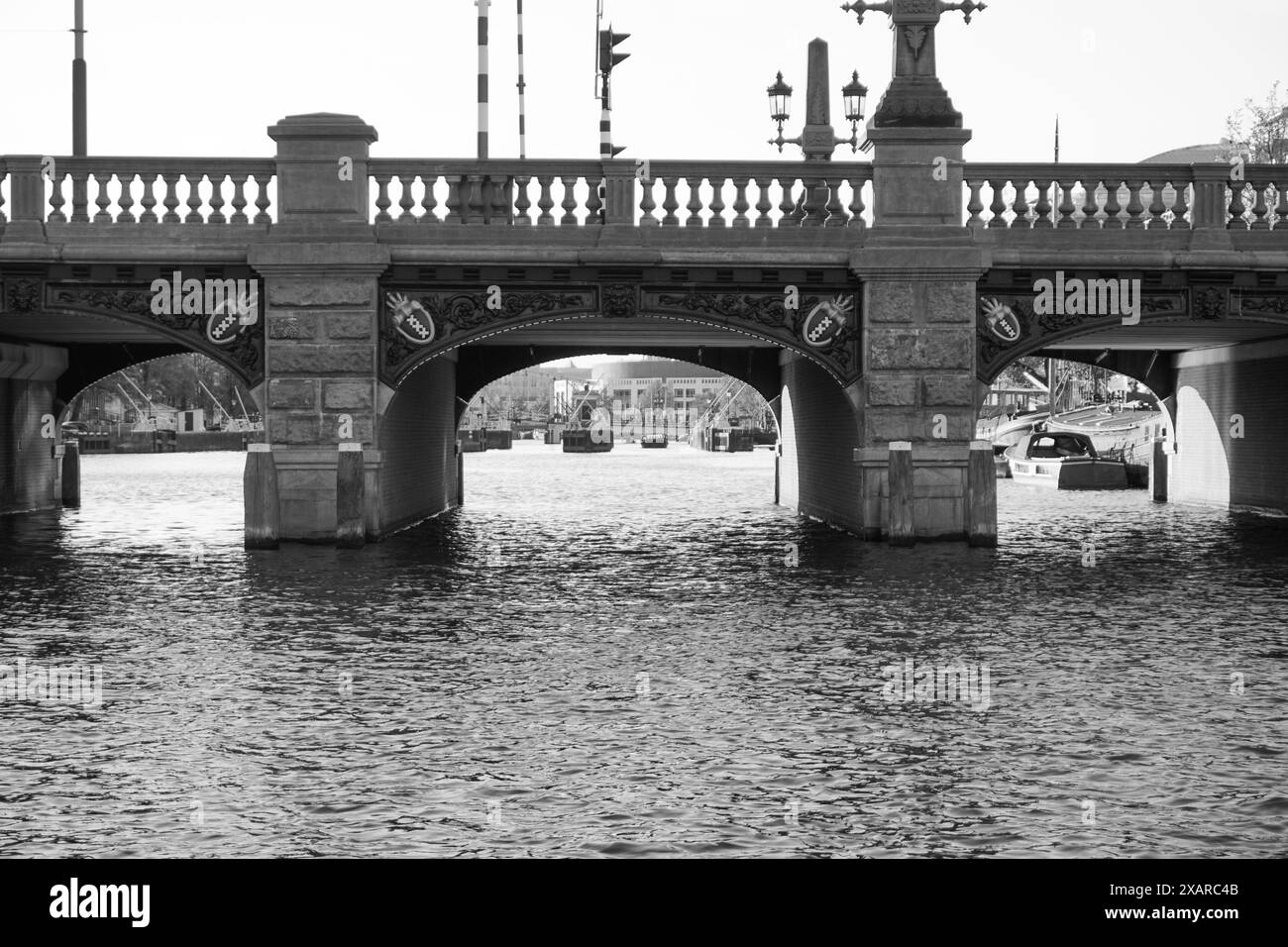 Person crossing bridge river Black and White Stock Photos & Images - Alamy