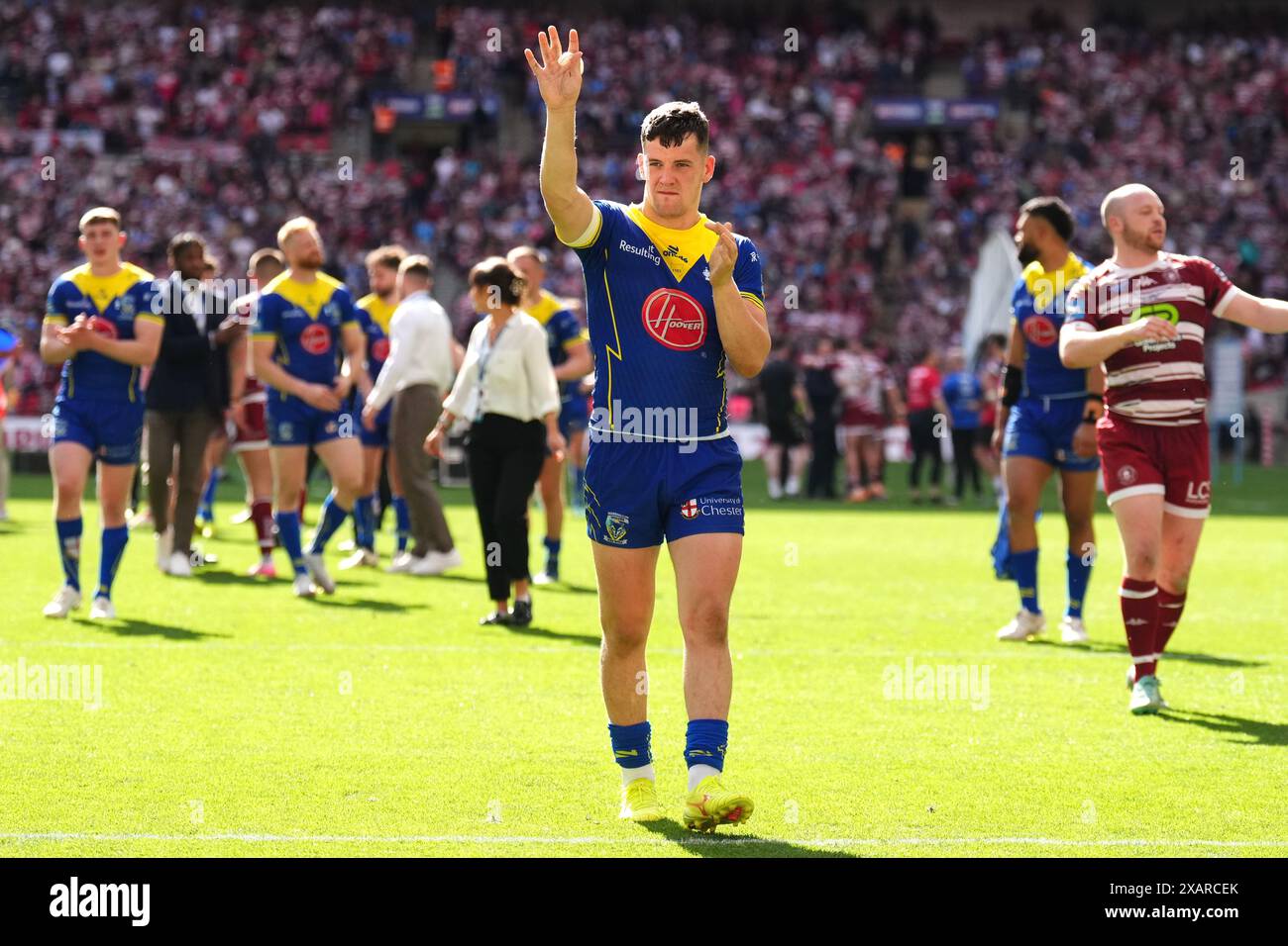 Warrington Wolves' Josh Thewlis (centre) acknowledges the fans after ...