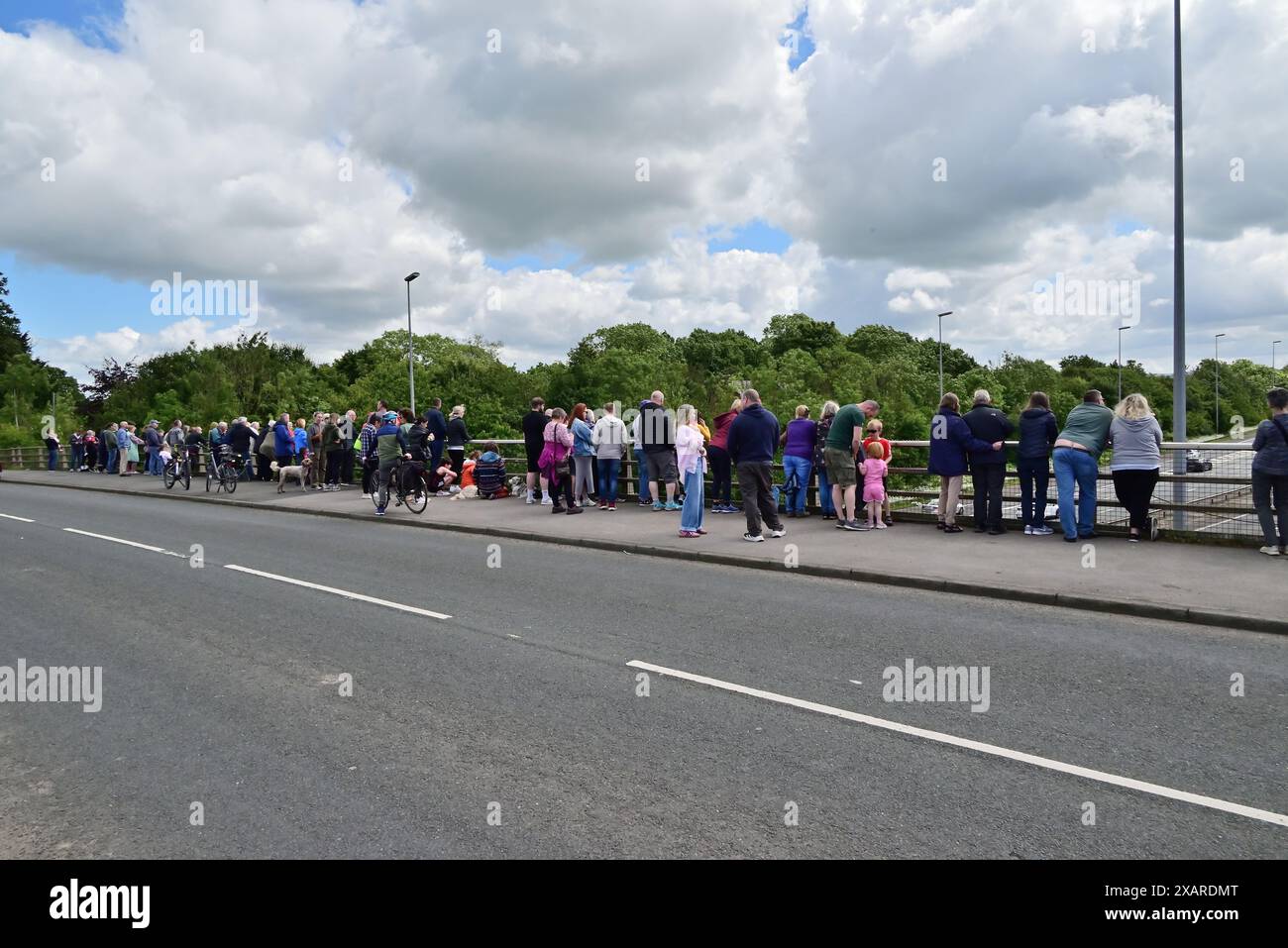 Crowds beginning to build on a bridge over the M6 at Bamber Bridge an ...