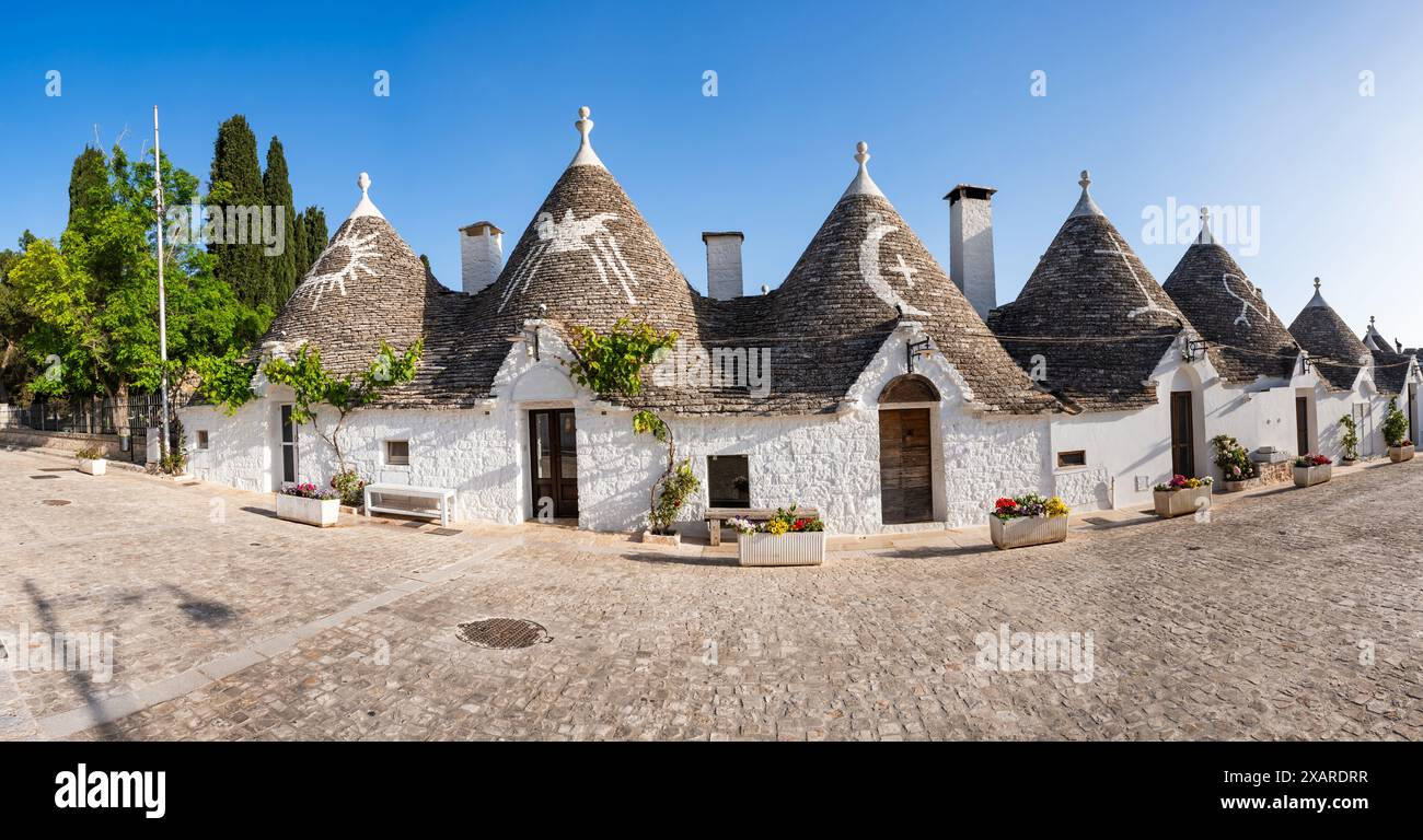 Famous traditional old dry stone trulli houses with conical roofs in ...