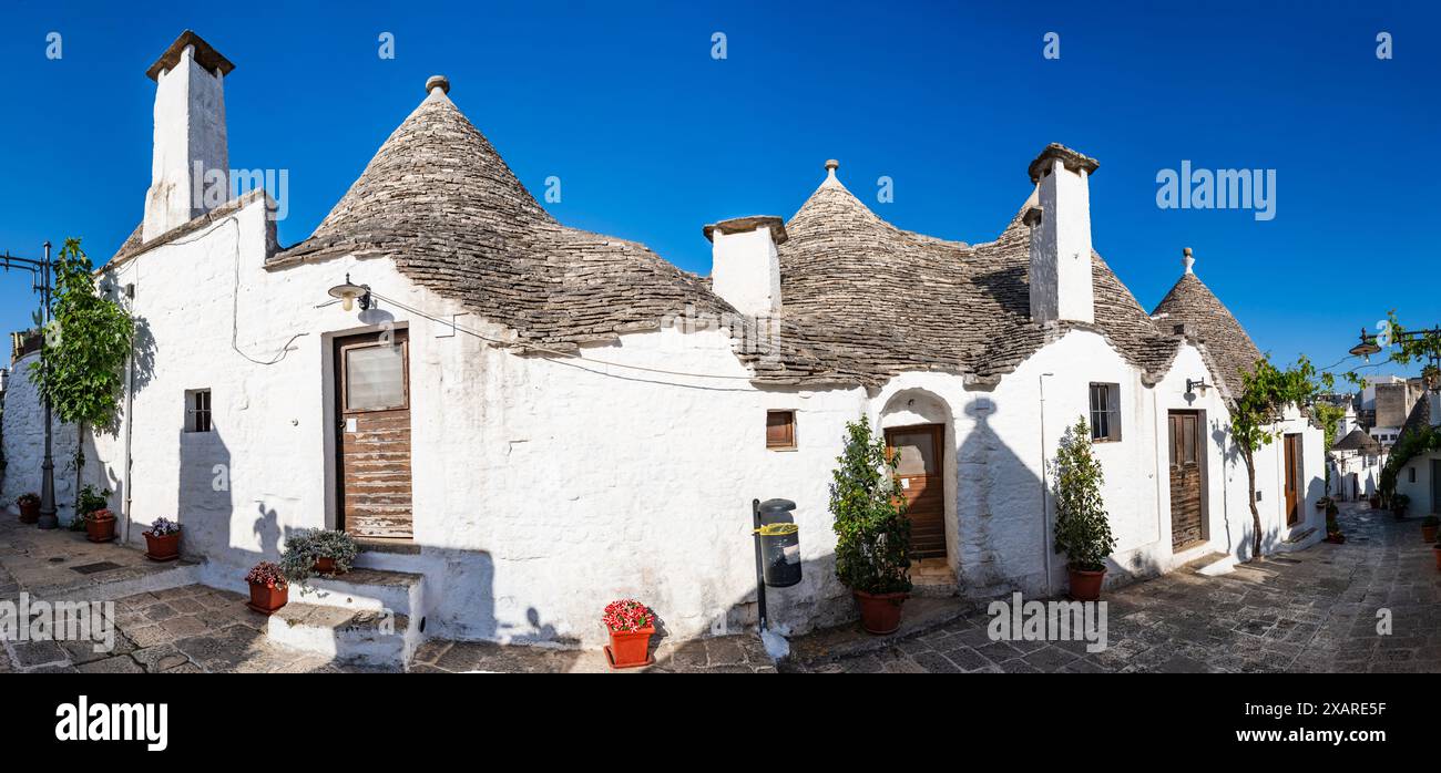 Famous traditional old dry stone trulli houses with conical roofs in ...
