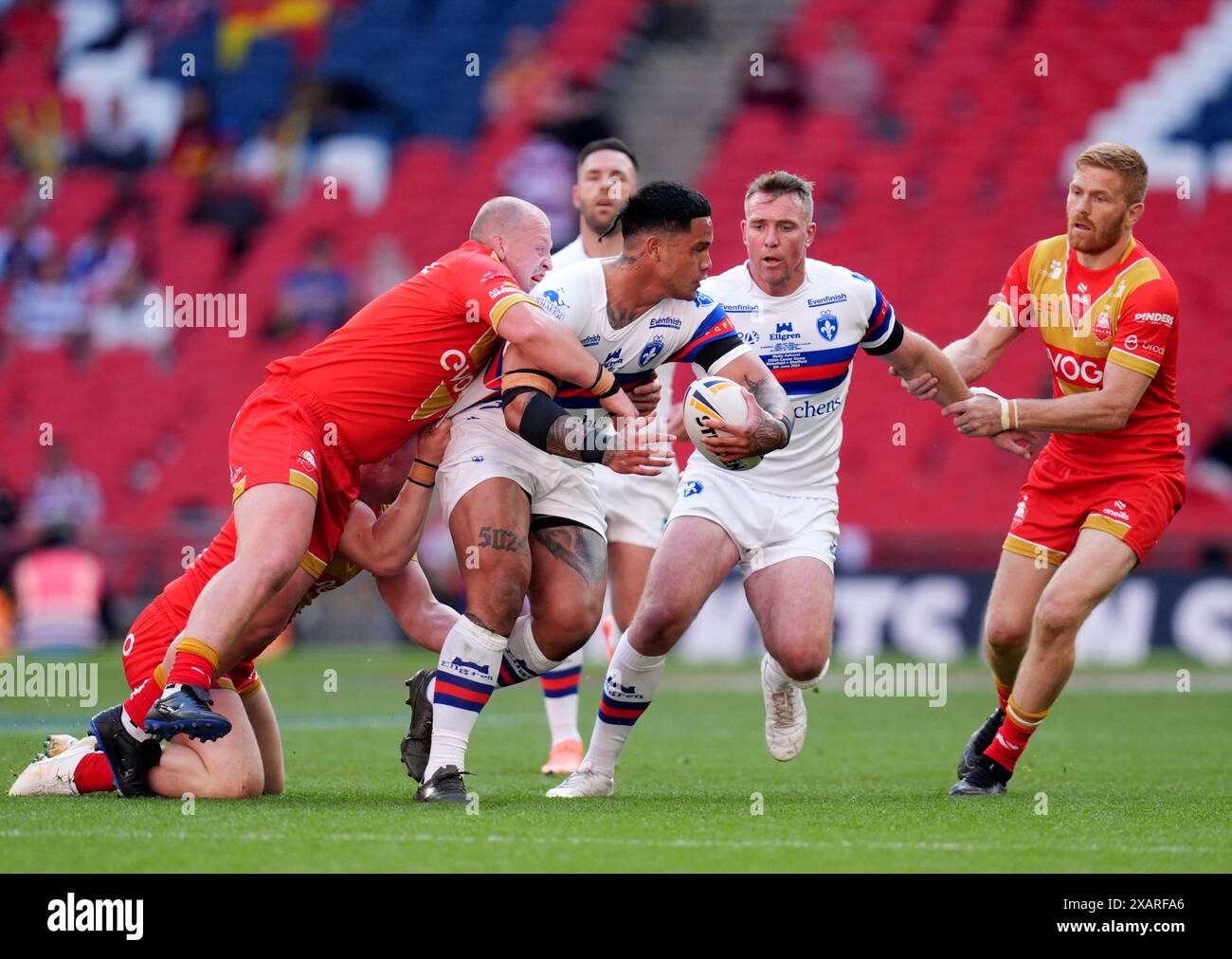Wakefield Trinity's Renouf Atoni (centre) is tackled by Sheffield ...
