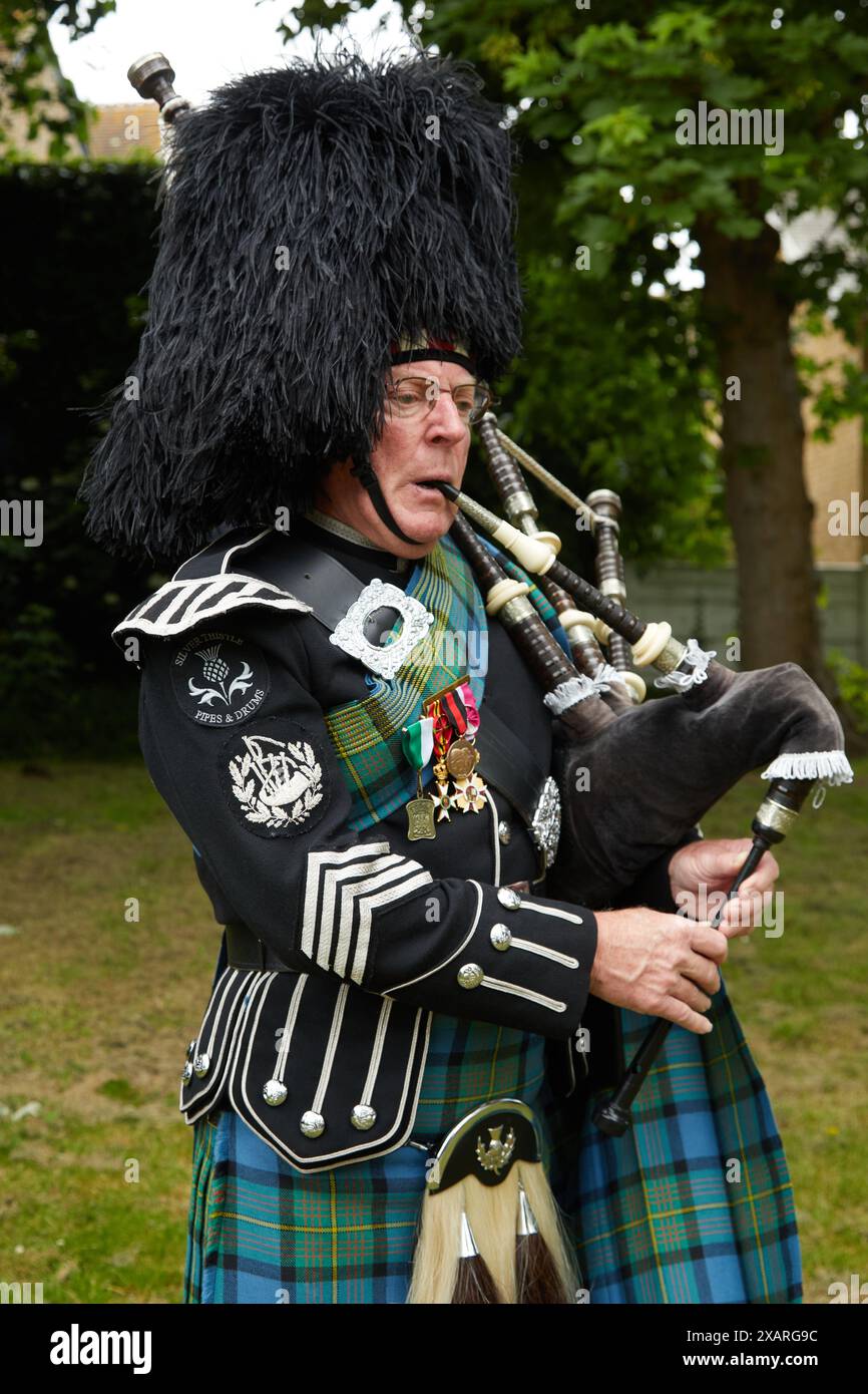 Pipe Major Diederik De Jaeger at the unveiling ceremony of The Peace ...