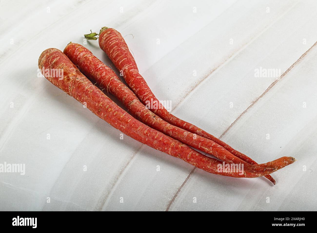 Raw ripe Indian red carrot root Stock Photo - Alamy