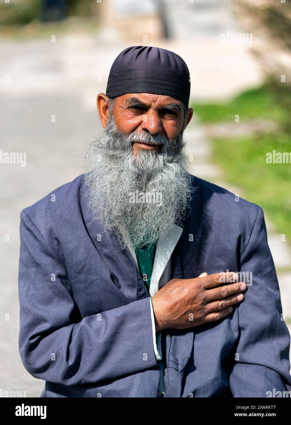 Uzbekistan, Samarkand, 03-04-2024: Man uzbek holding his hand on his ...