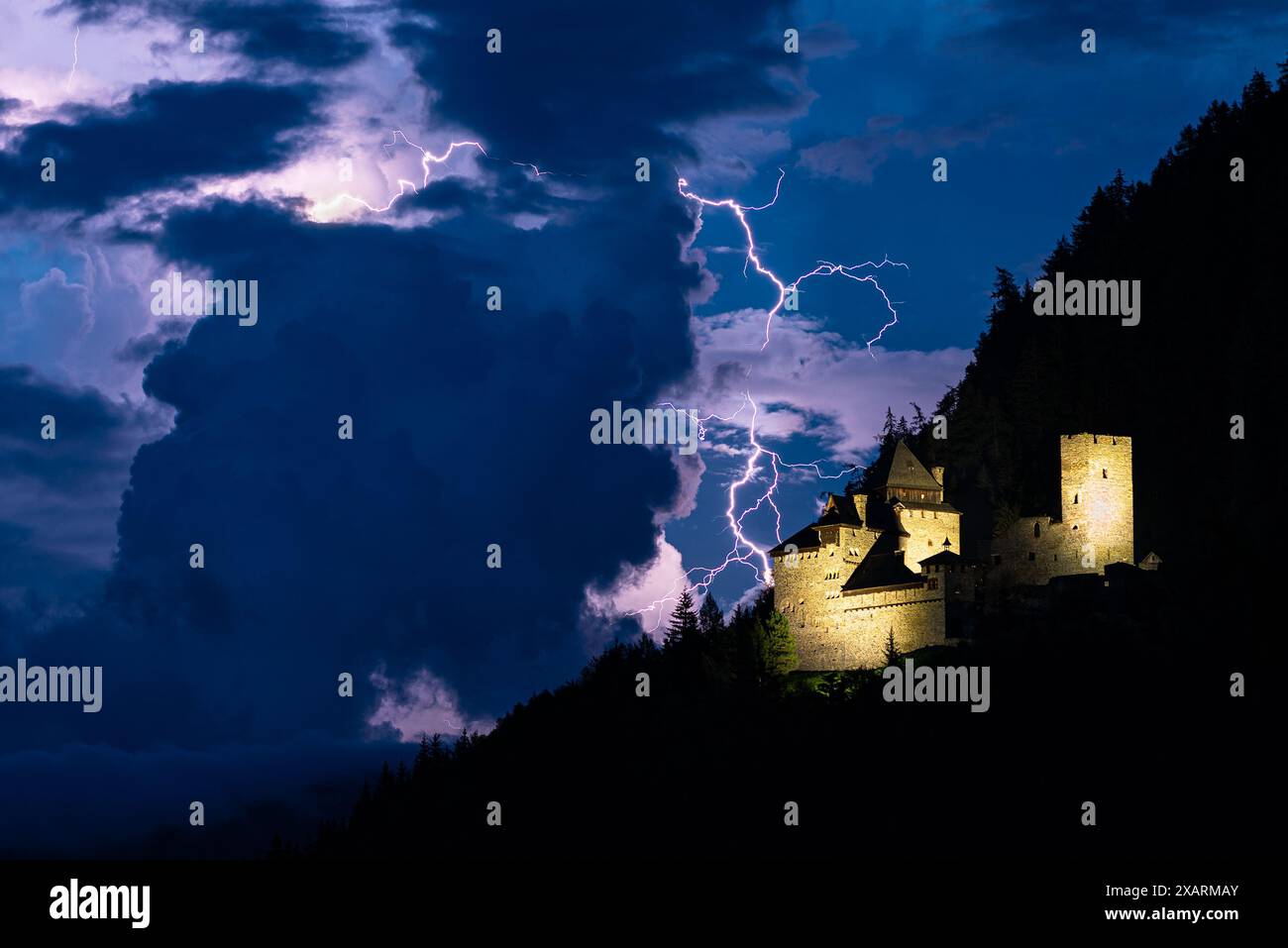 Spooky image of a lightning bolt striking down from a thundercloud ...