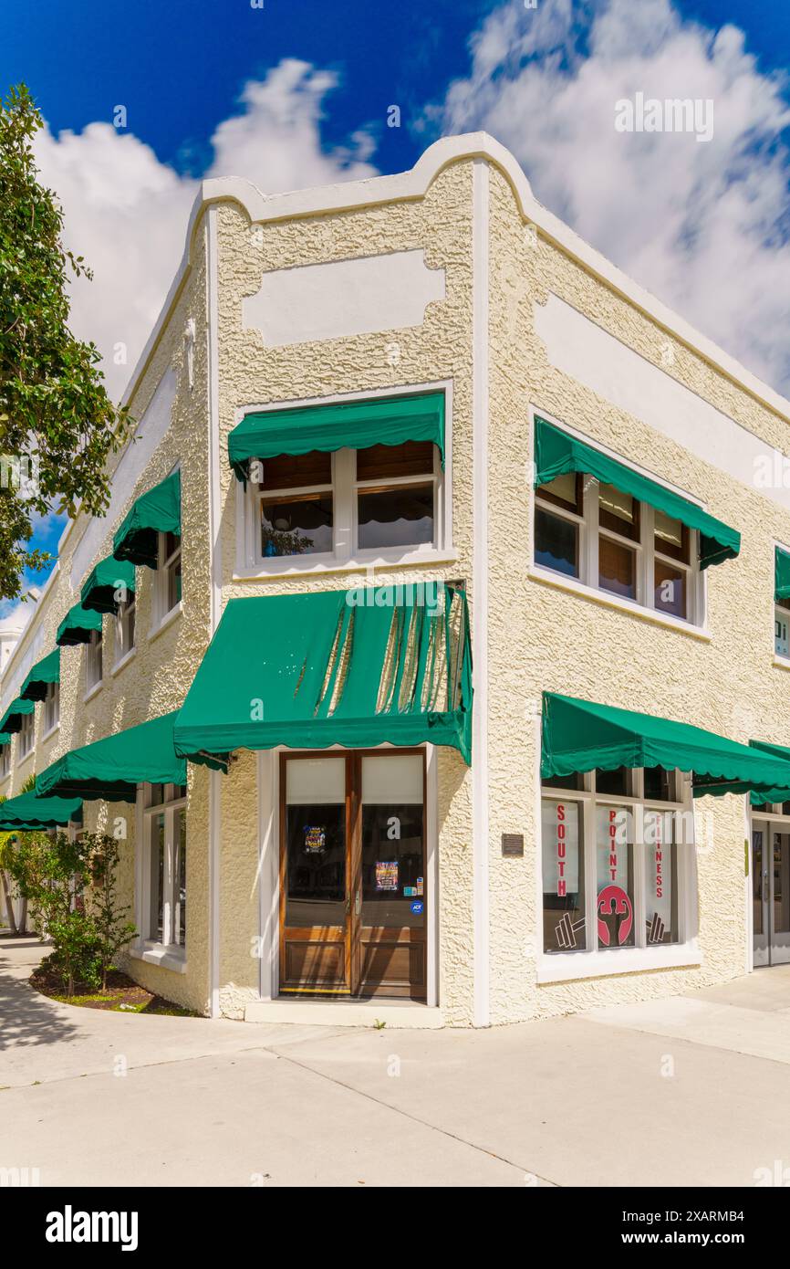 Generic old building with torn and tattered green swnings Stock Photo ...